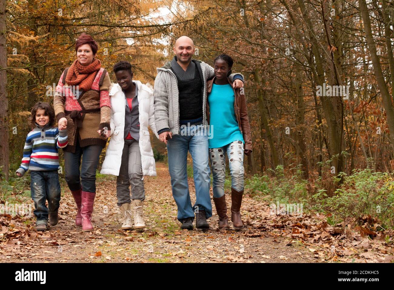 Walk with the multicultural family Stock Photo - Alamy