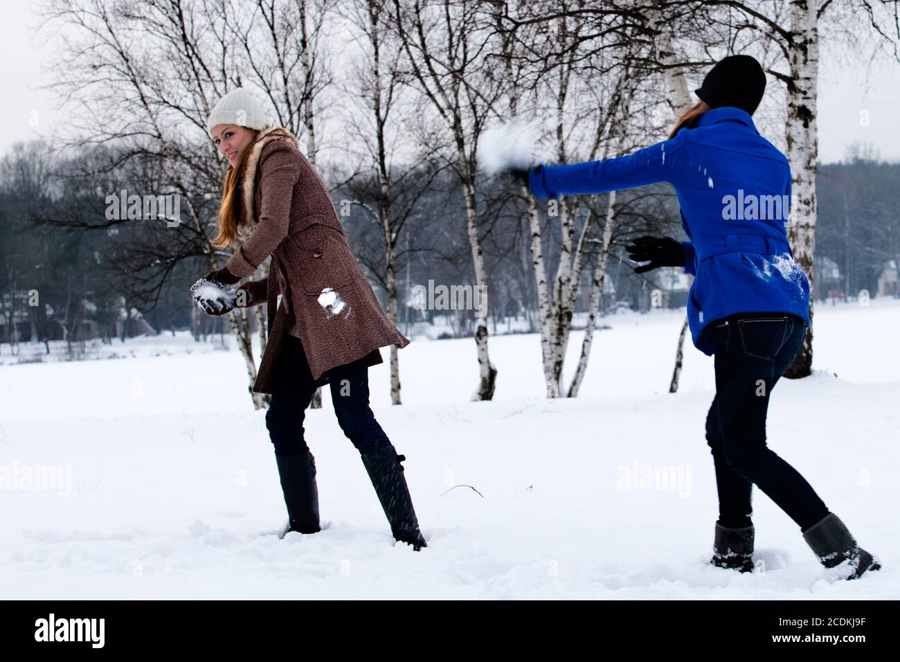 sisters snow ball fight Stock Photo - Alamy