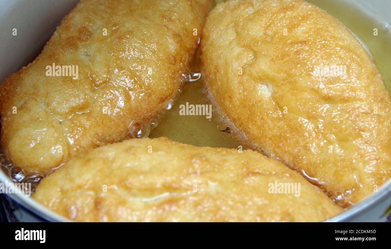 cakes fried in oil Stock Photo - Alamy