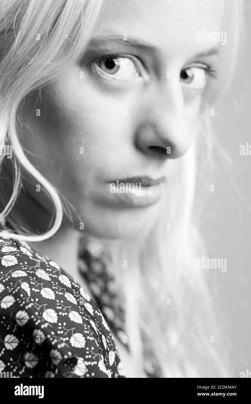 Beautifull blond looking disturbed Stock Photo - Alamy