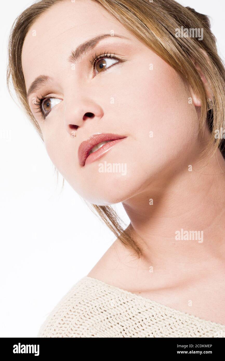 young woman looking up thinking Stock Photo - Alamy