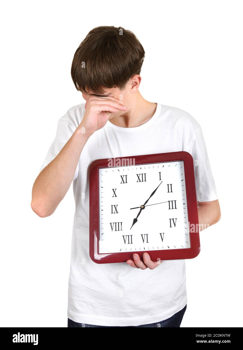 Tired Young Man with Big Clock Stock Photo - Alamy
