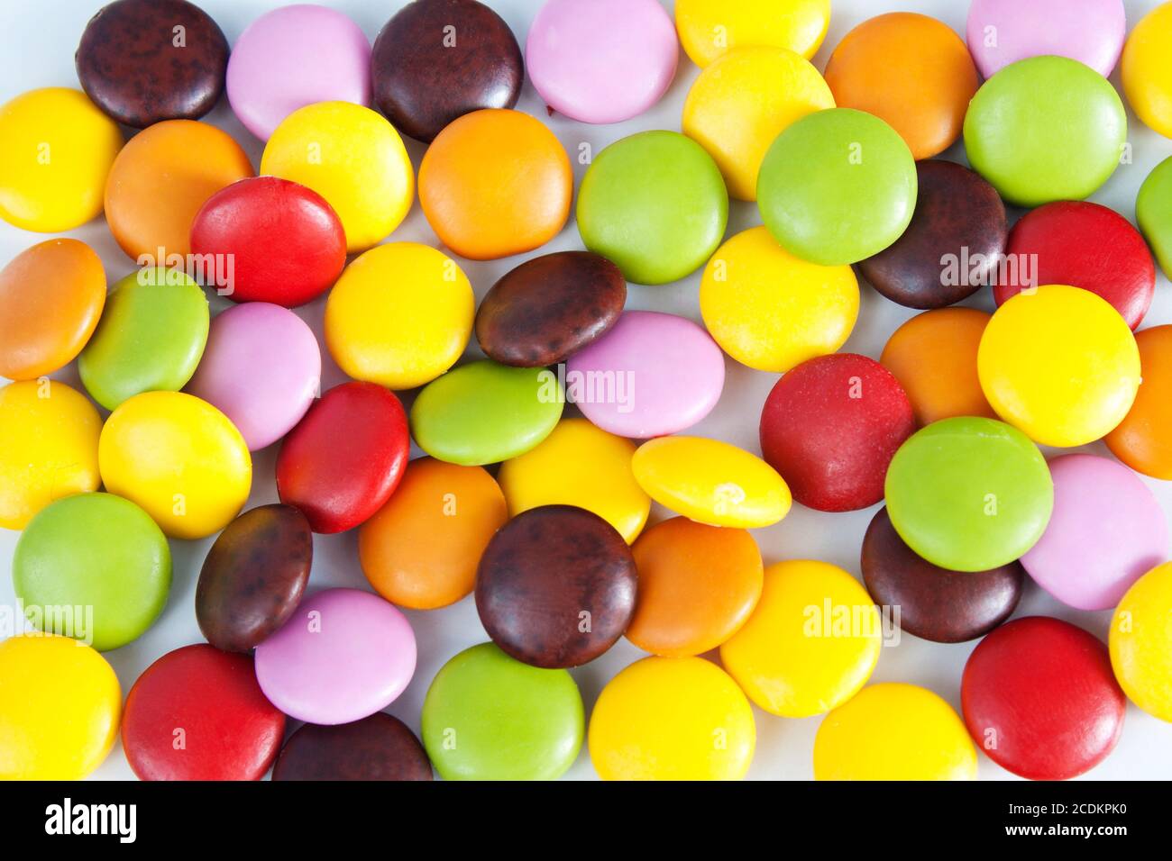 Many colourful halloween candy filling background Stock Photo - Alamy