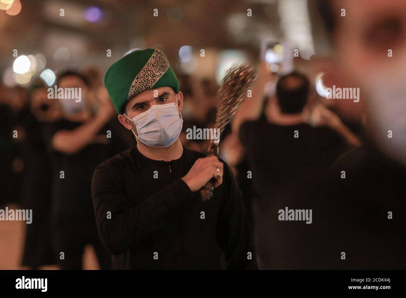 Baghdad, Iraq. 28th Aug, 2020. A Shia Muslim man, wearing a face mask ...