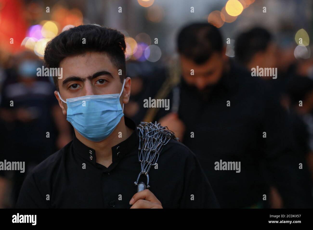 Baghdad, Iraq. 28th Aug, 2020. A Shia Muslim man, wearing a face mask ...