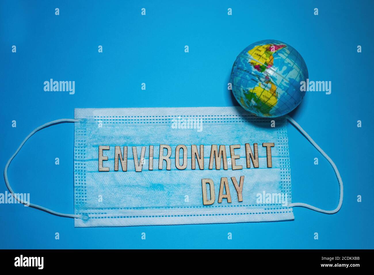 Word ENVIRONMENT DAY of wooden letters against background of protective ...