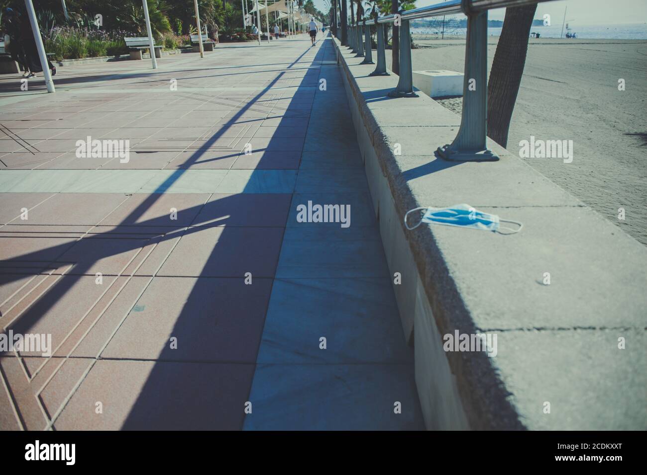 Medical face mask in the street Stock Photo - Alamy