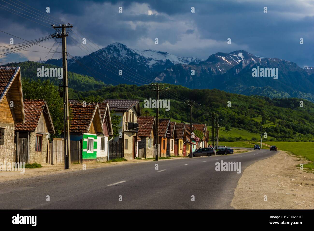 Colorful street scene with very narrow house painted Stock Photo - Alamy