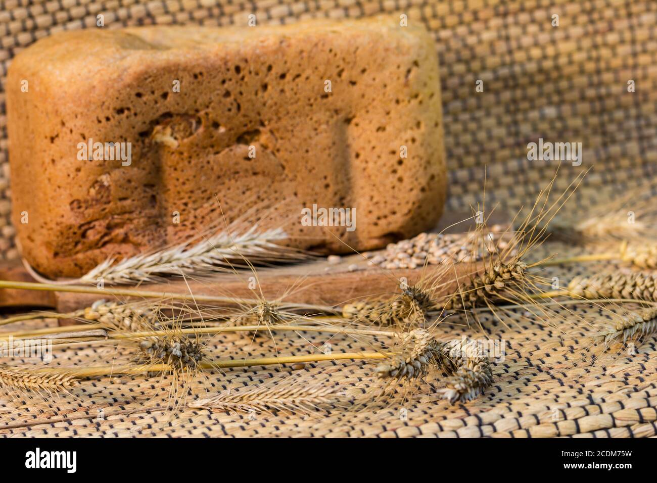 Homemade bread on a rustic scene with wheat Stock Photo - Alamy