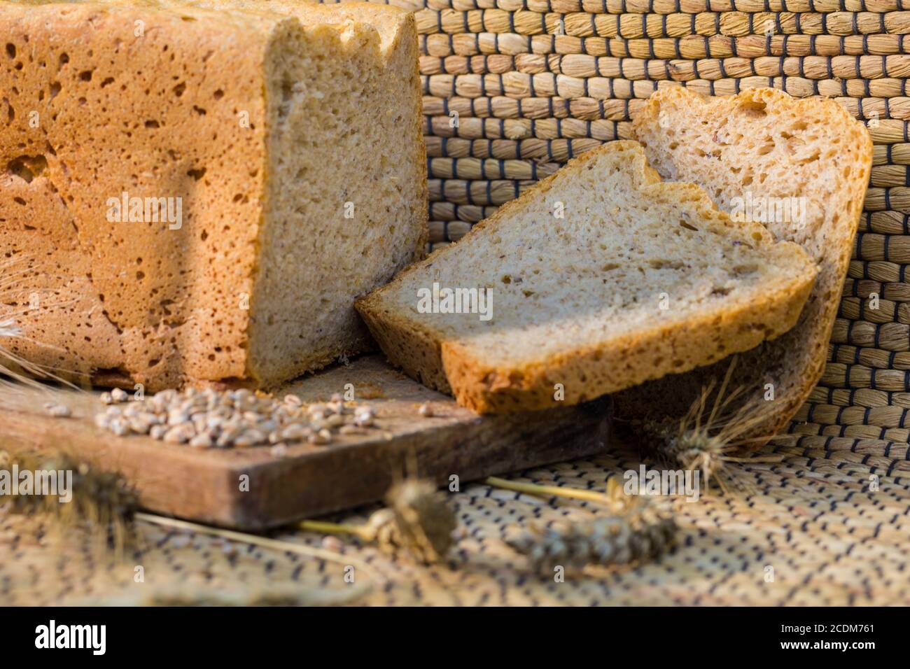 Homemade bread on a rustic scene with wheat Stock Photo - Alamy