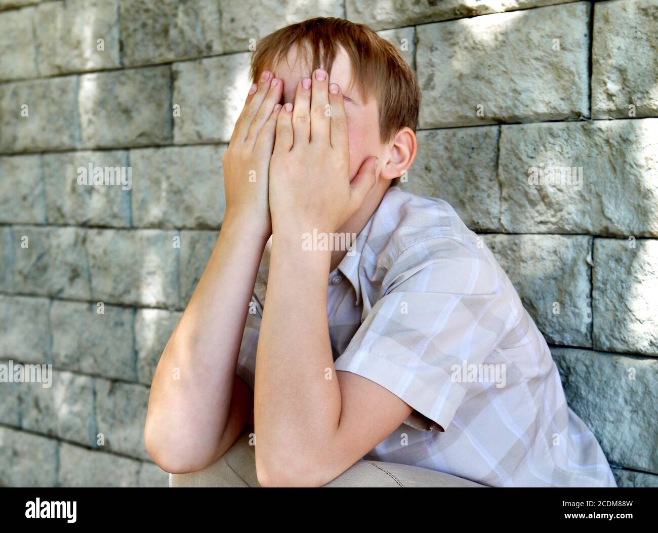Sad Kid outdoor Stock Photo - Alamy