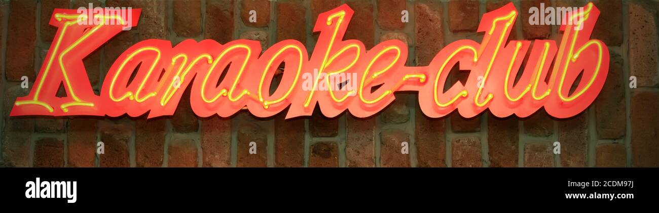 Red and yellow sign board of karaoke club Stock Photo - Alamy