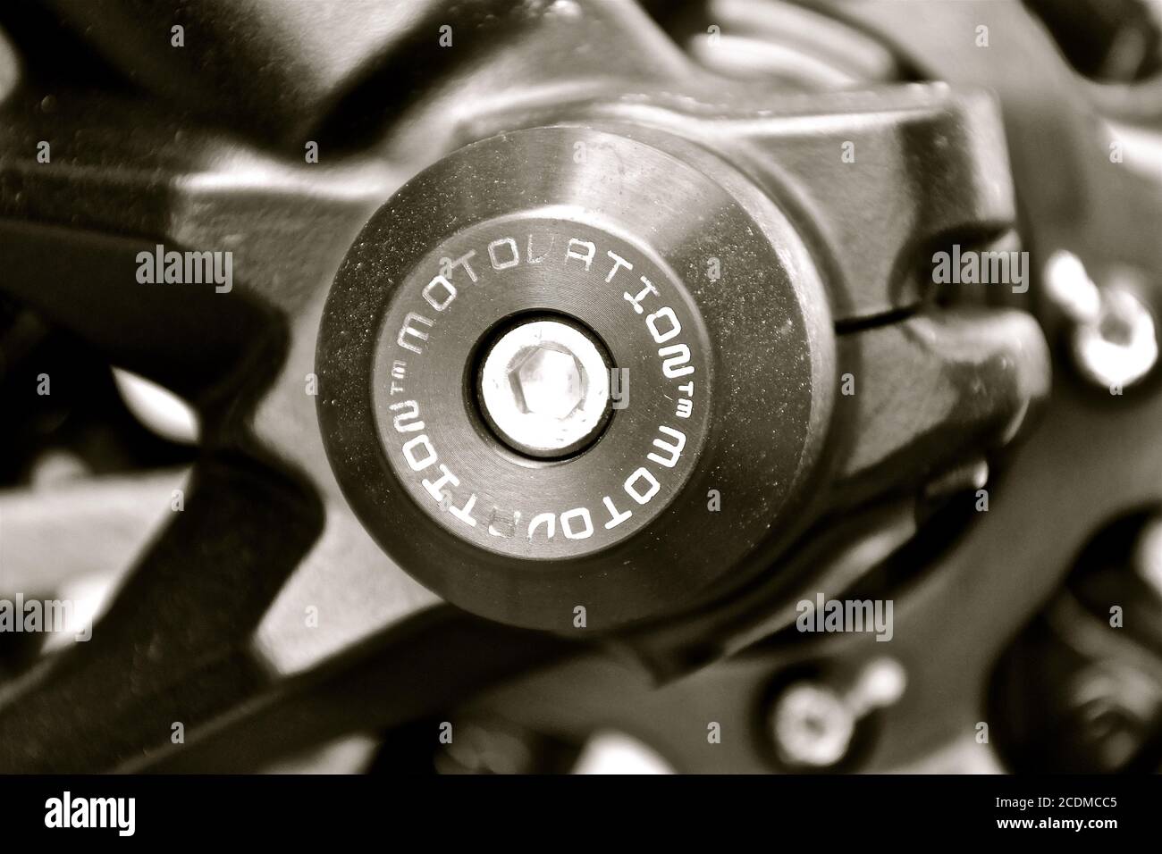 A macro image of stainless steel bolt on a high end classic motorbike ...