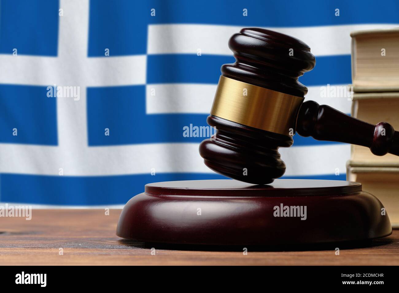 Justice and court concept in Greece. Judge hammer on a flag background ...