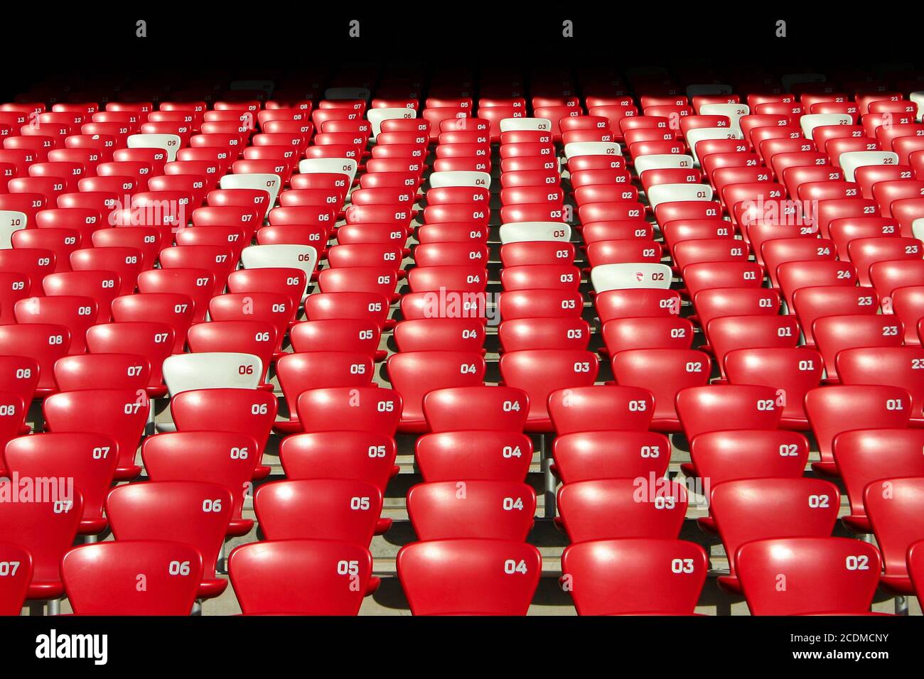 Red football seats hi-res stock photography and images - Alamy