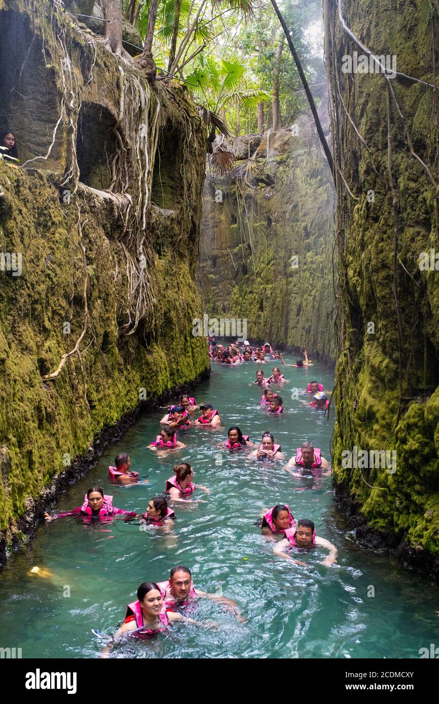 XCARET,MEXICO - APRIL 16,2019 : Visitors enjoying the underground river ...