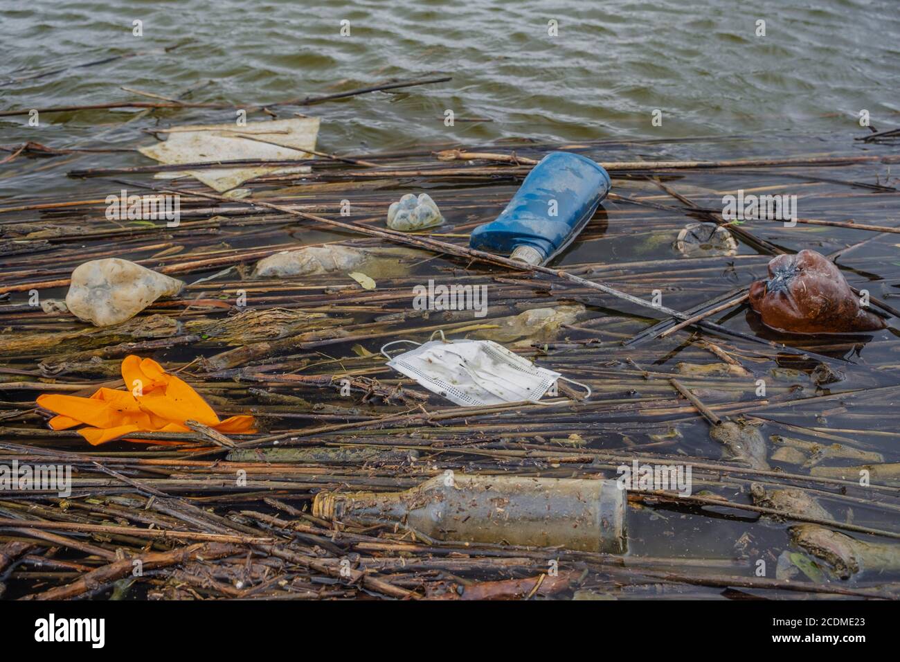 Symbolic image Environmental pollution, plastic waste on the banks of ...