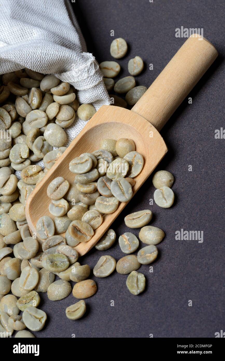 Green coffee beans with wooden shovel hi-res stock photography and ...
