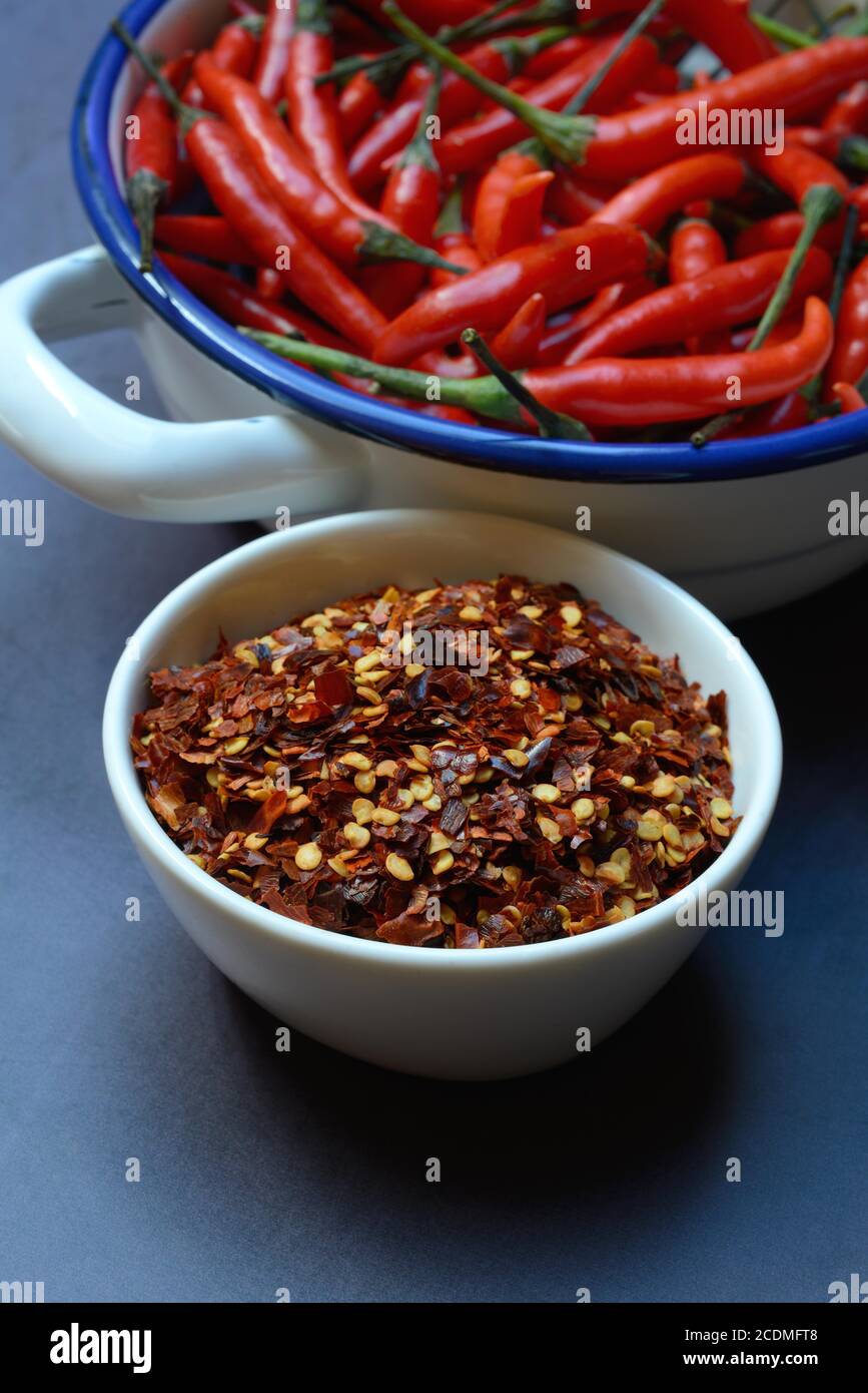Chilli peppers in shell and chilli flakes hi-res stock photography and ...