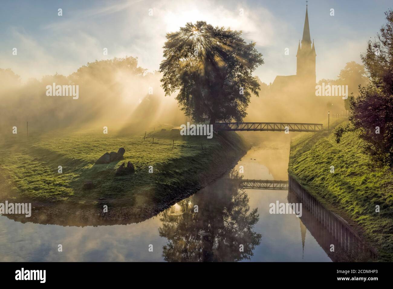 Morning fog old harbour Weser and catholic church, Rinteln, Germany ...