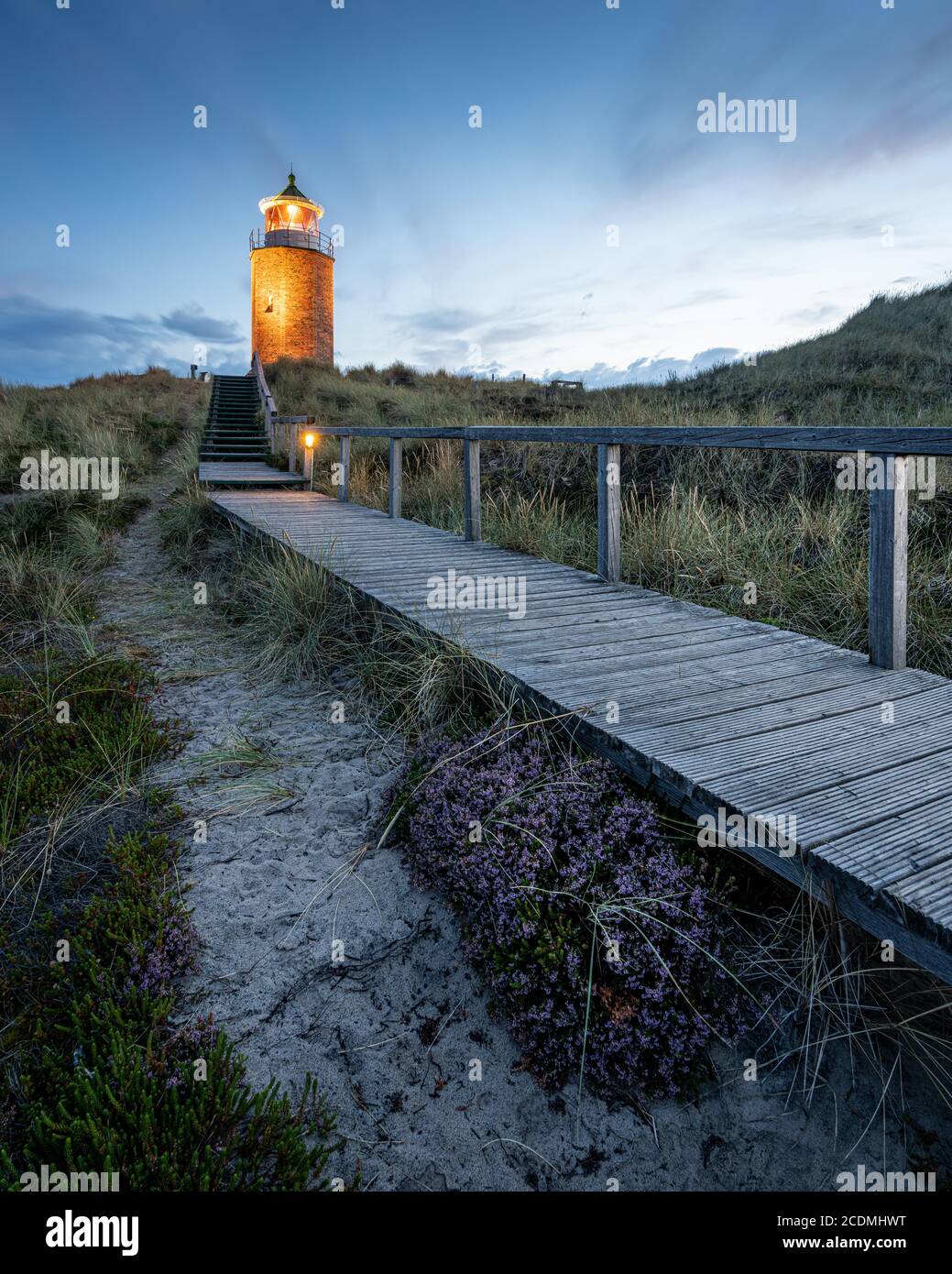 Cross light, lighthouse with sand dune at dusk, Kampen, Sylt, Germany ...