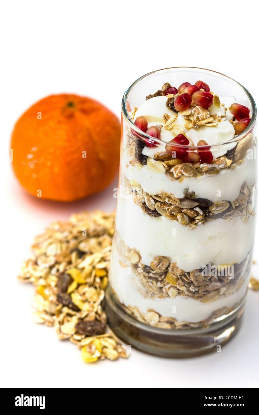 Glass of Muesli with fruits and yogurt isolated on white Stock Photo ...
