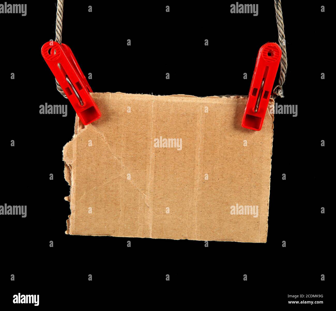 Cardboard on the Rope Stock Photo - Alamy