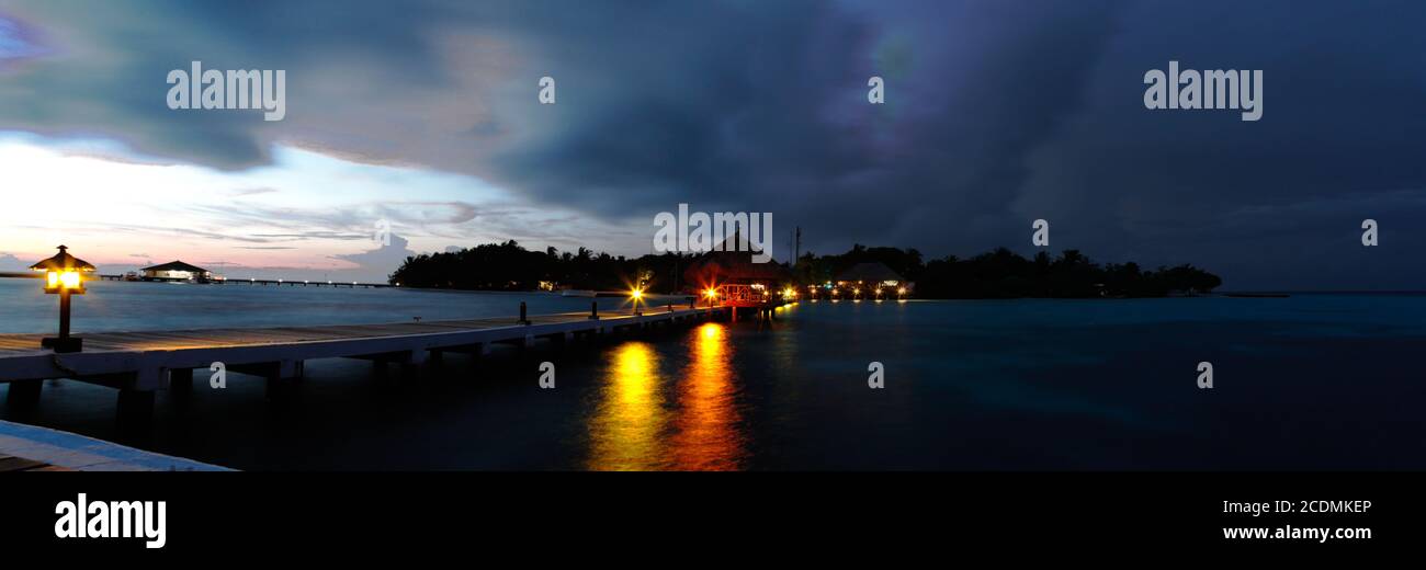 Maldives, island in the evening with lighting Stock Photo - Alamy