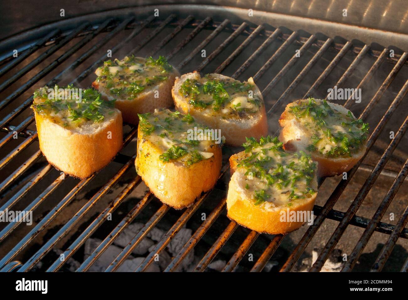 Garlic Breads on a Barbecue Stock Photo - Alamy