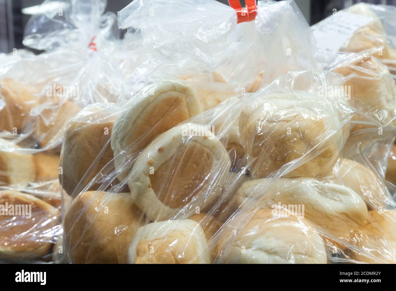 baked butter breads of dinner roll in supermarket Stock Photo - Alamy