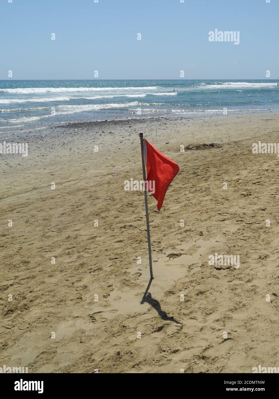 Red flag on a beach Stock Photo - Alamy