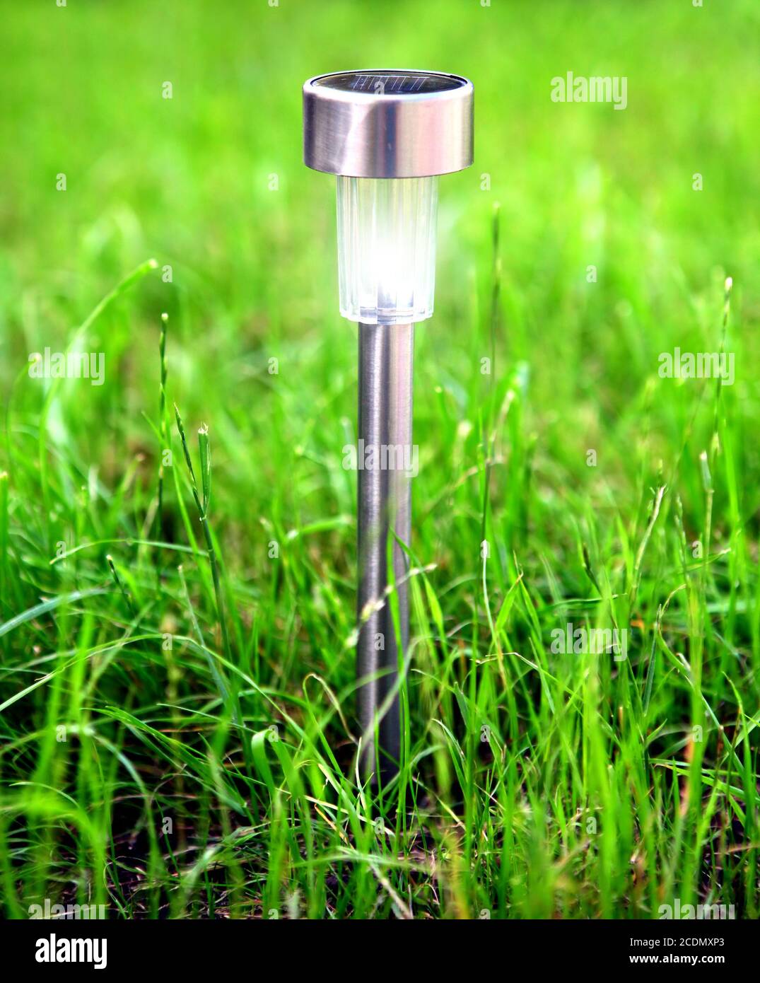 Lamp on the Grass Stock Photo - Alamy