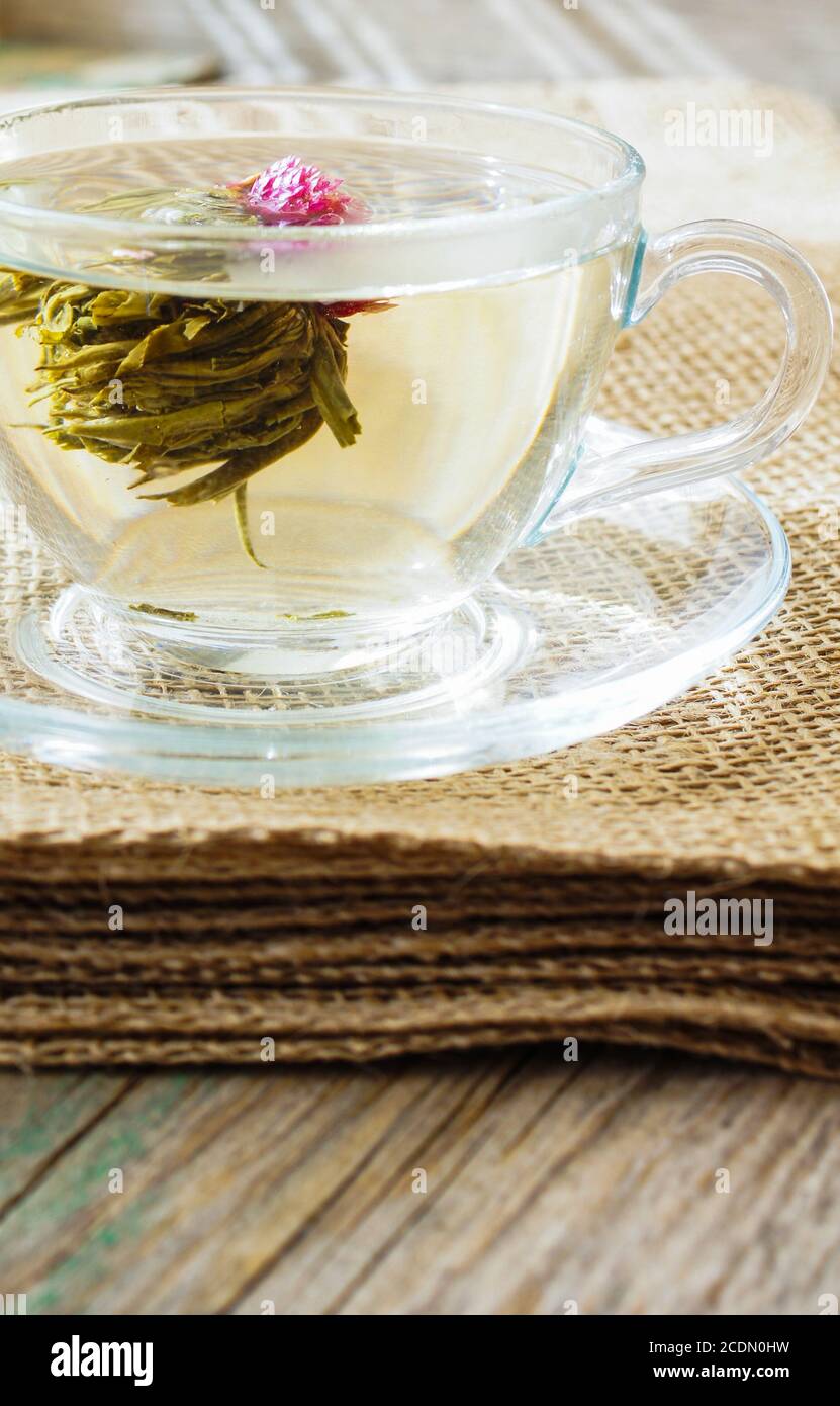 Chinese green tea balls with flowers, tea cup Stock Photo - Alamy