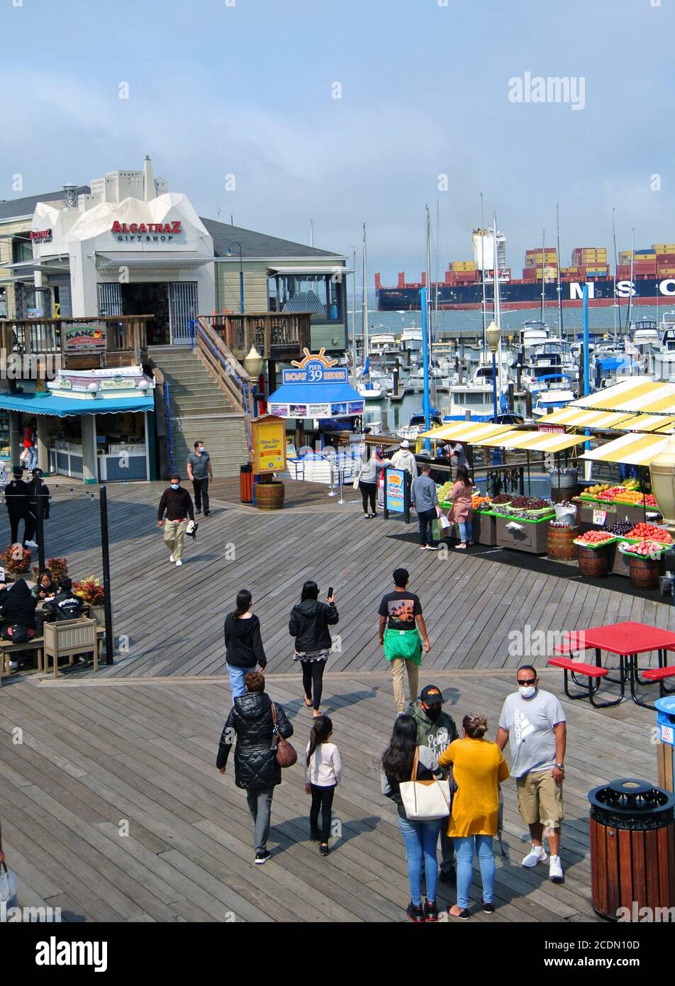 tourists return to pier 39 in august of 2020 during covid 19 wearing ...