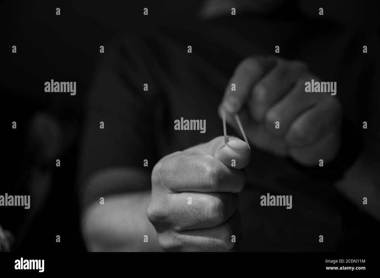Pulling rubber band with hand hi-res stock photography and images - Alamy