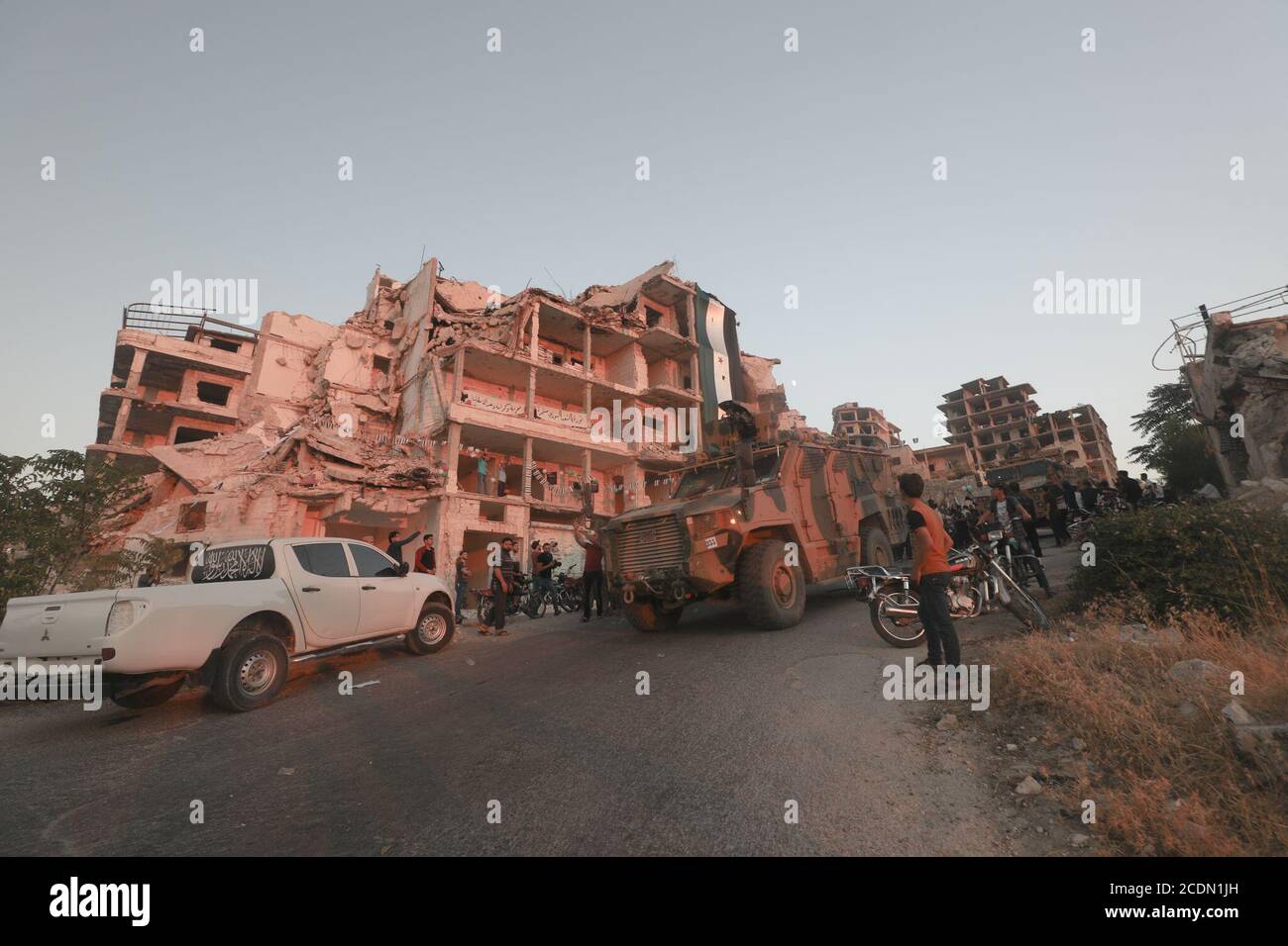 Ariha, Syria. 28th Aug, 2020. A Turkish military vehicle passes past ...