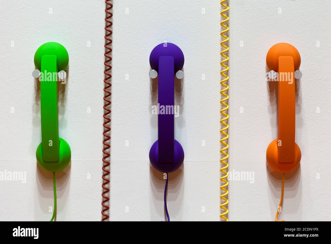 Color phones and phone cords Stock Photo - Alamy