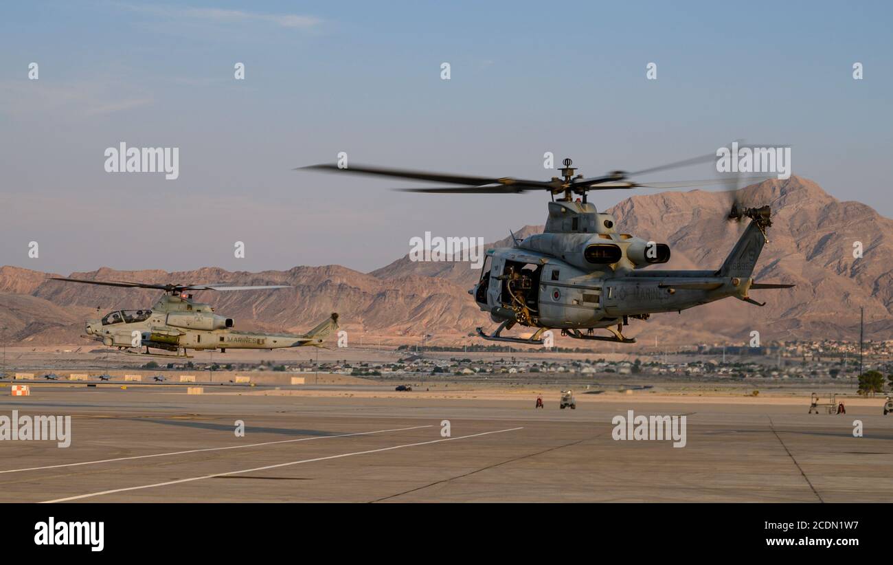 A AH-1Z Viper and a UH1-Y Venom helicopter assigned to Marine Light ...