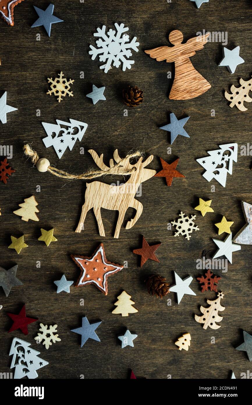 Christmas cad concept with holiday wooden decoration on dark moody ...