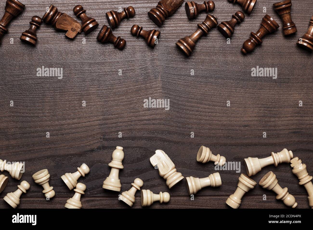 chess figures on brown woden table background Stock Photo - Alamy