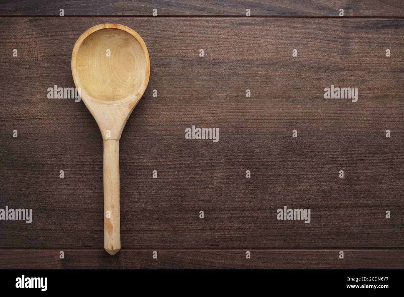 wooden spoon on the blue table Stock Photo - Alamy