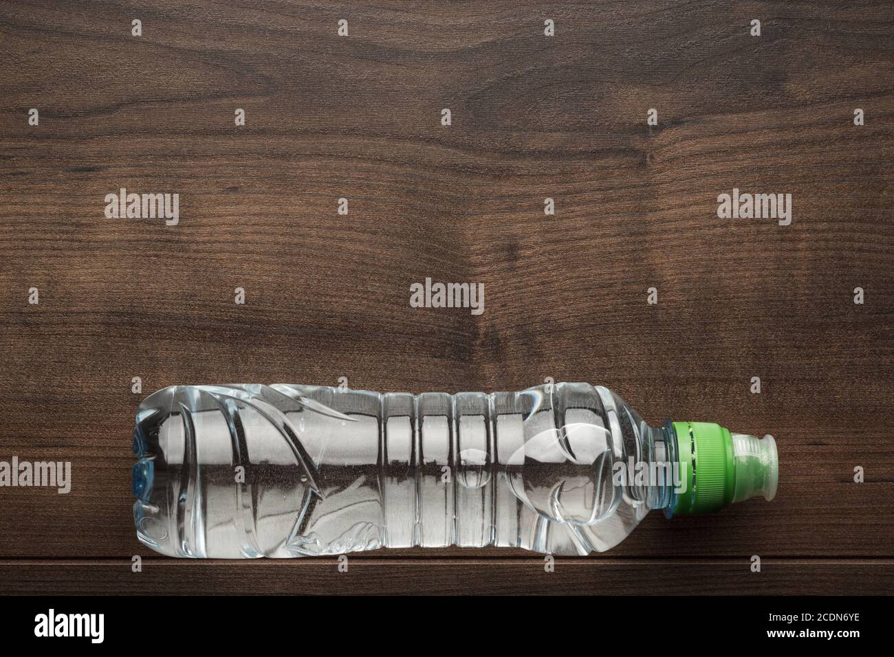 plastic water bottle on the table Stock Photo - Alamy