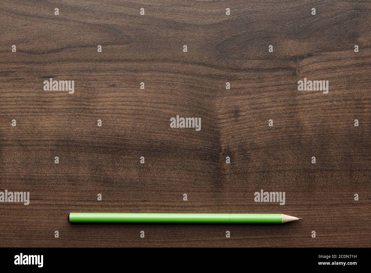 green pencil on the table Stock Photo - Alamy