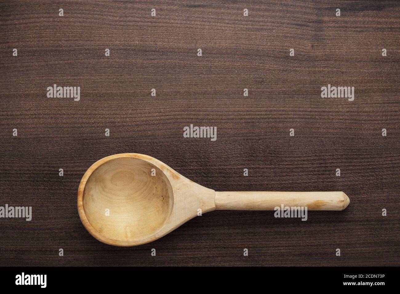 wooden spoon on the blue table Stock Photo - Alamy