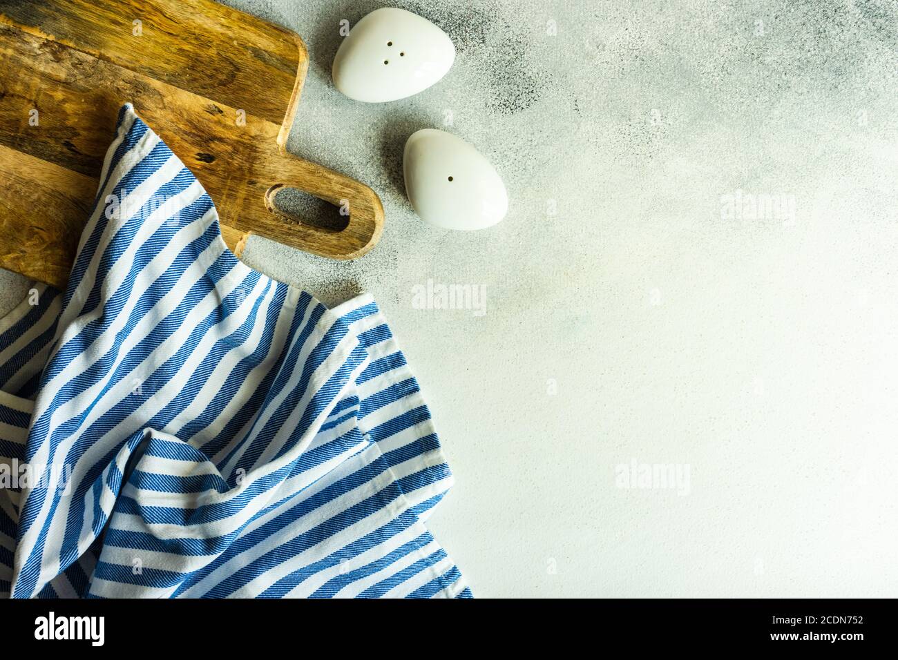 Cooking frame with spices and towel on concrete background with copy ...