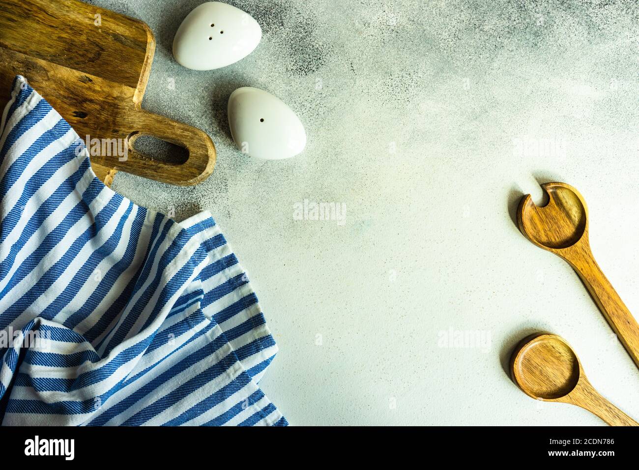 Cooking frame with spices and towel on concrete background with copy ...