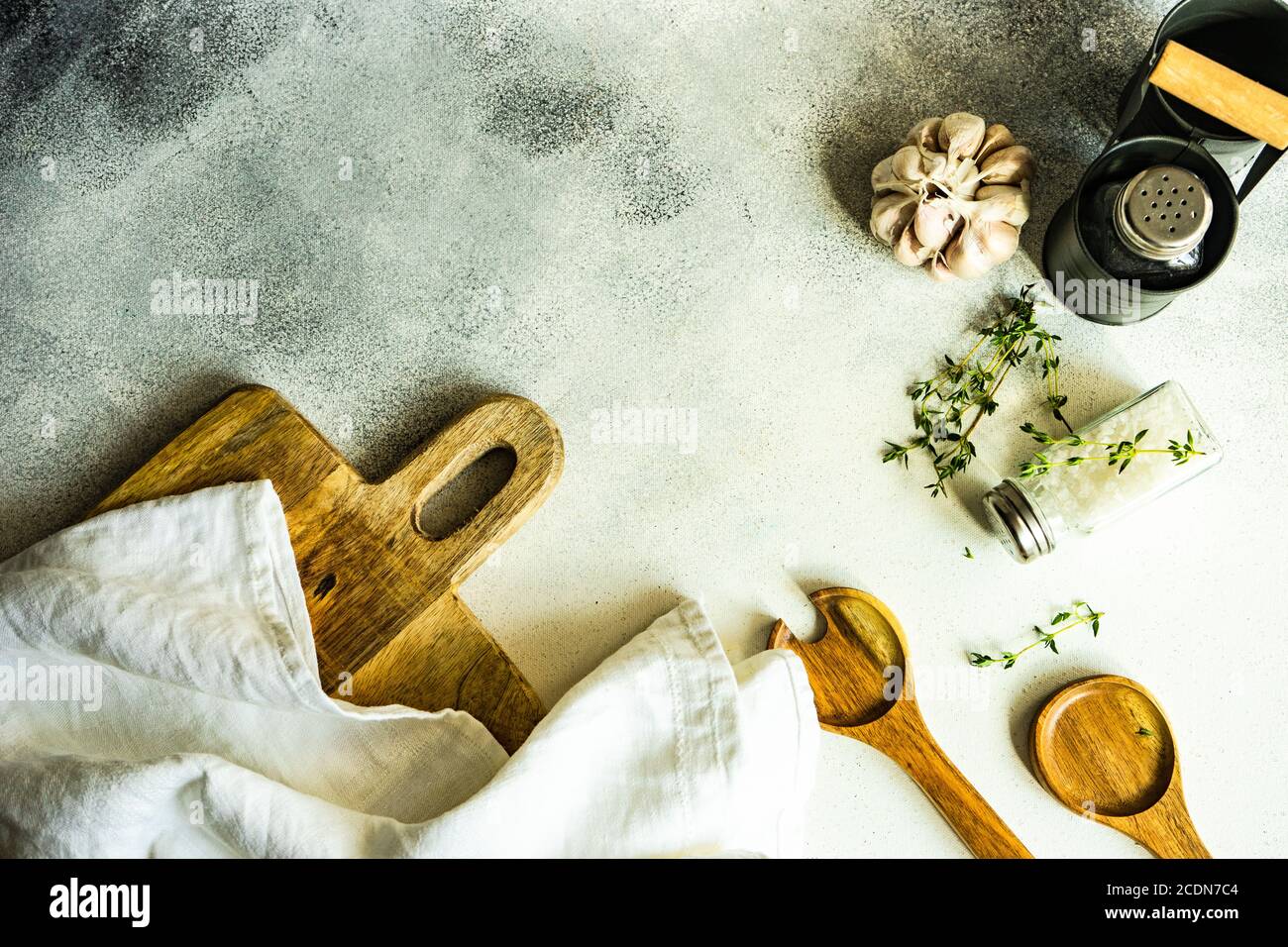 Cooking frame with spices and towel on concrete background with copy ...