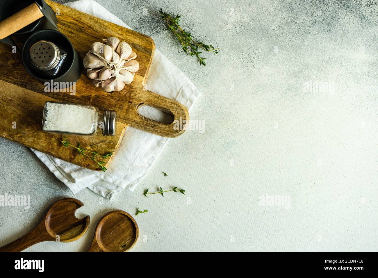 Cooking frame with spices and towel on concrete background with copy ...
