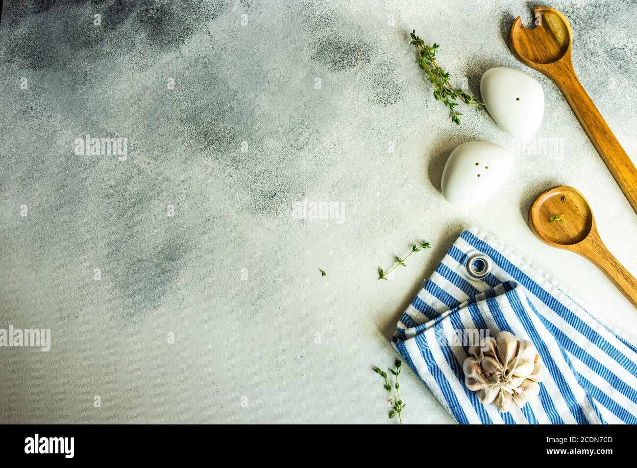 Cooking frame with spices and towel on concrete background with copy ...
