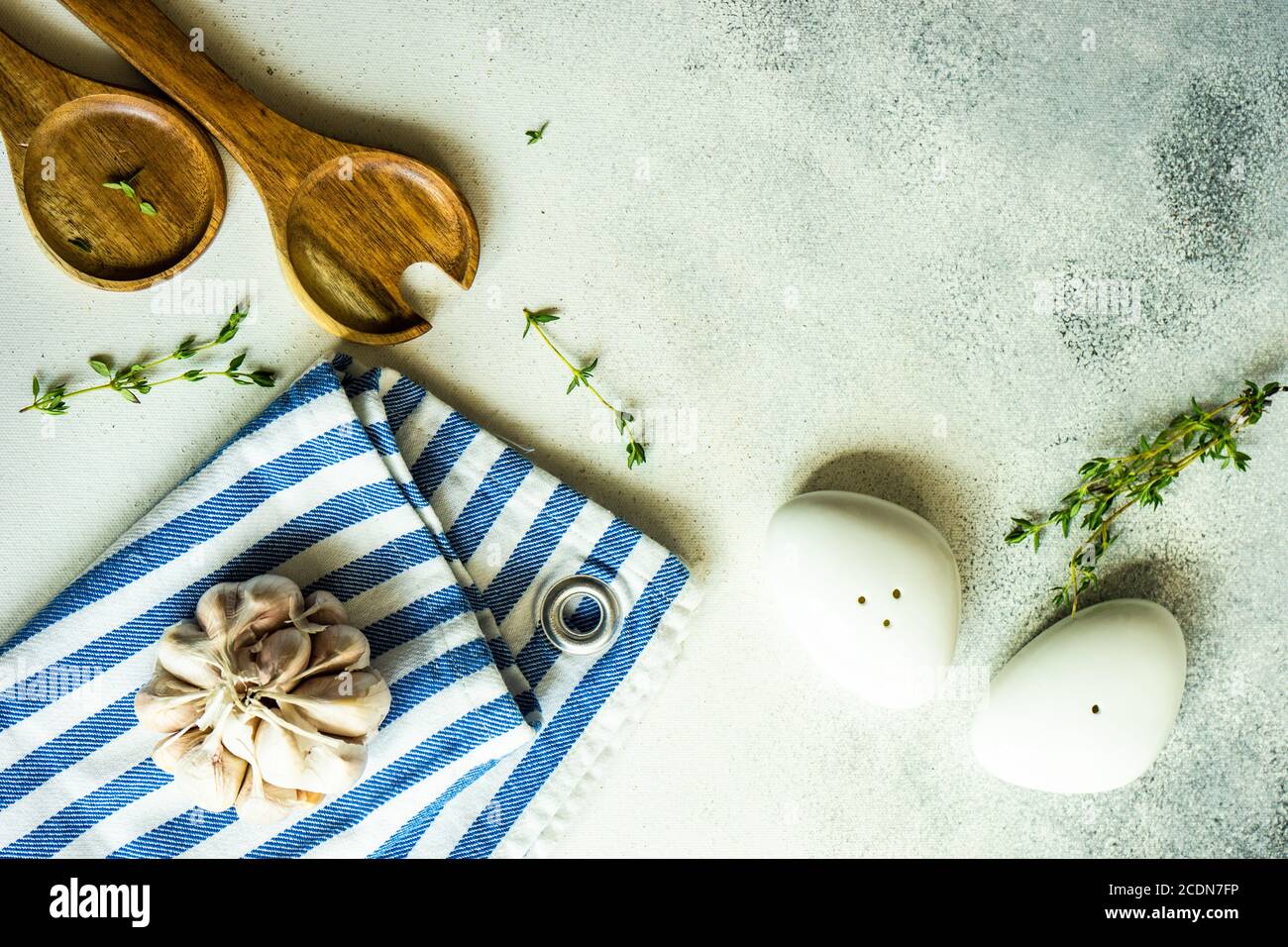 Cooking frame with spices and towel on concrete background with copy ...
